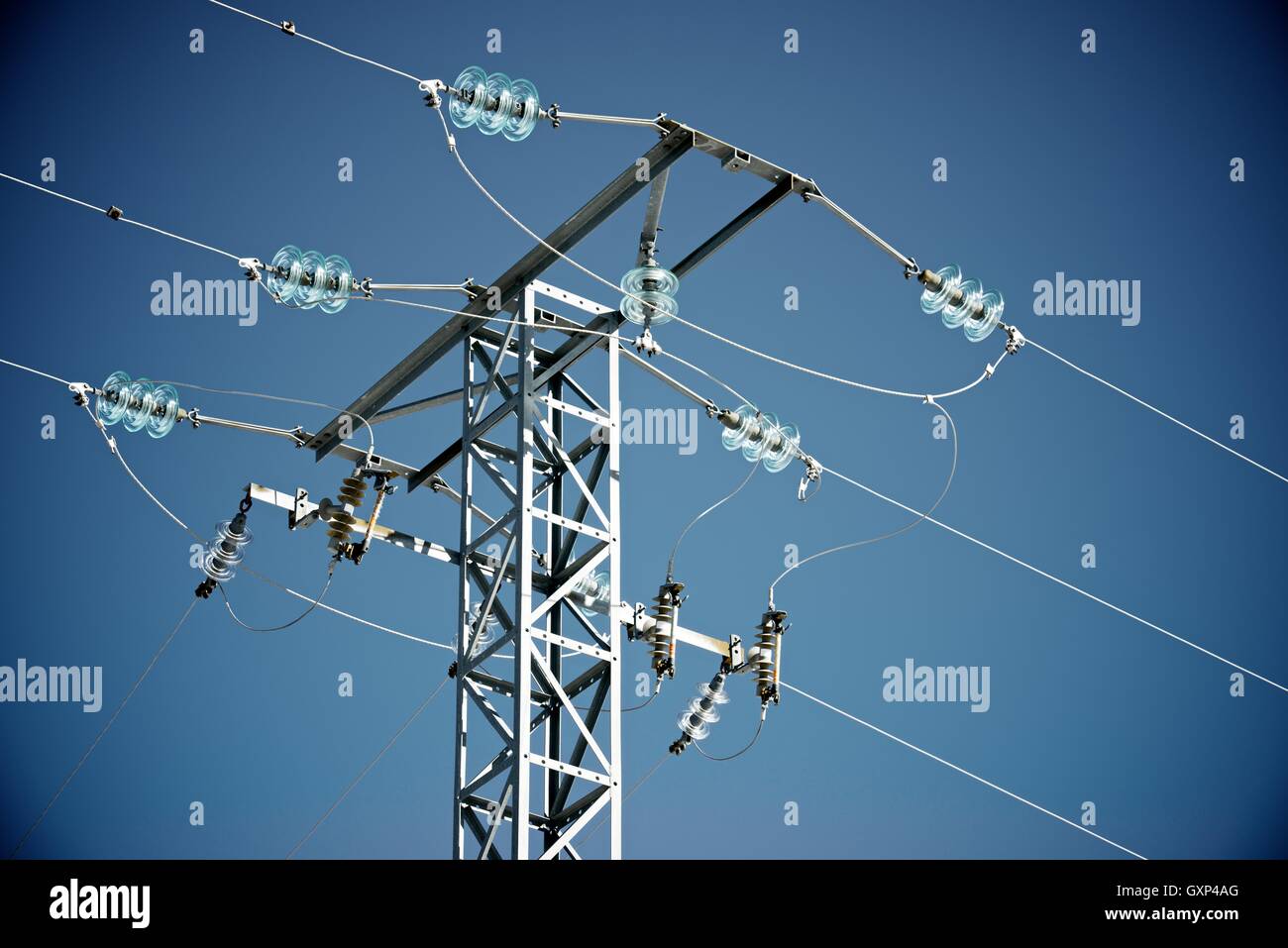 Power line with clear blue sky Stock Photo - Alamy