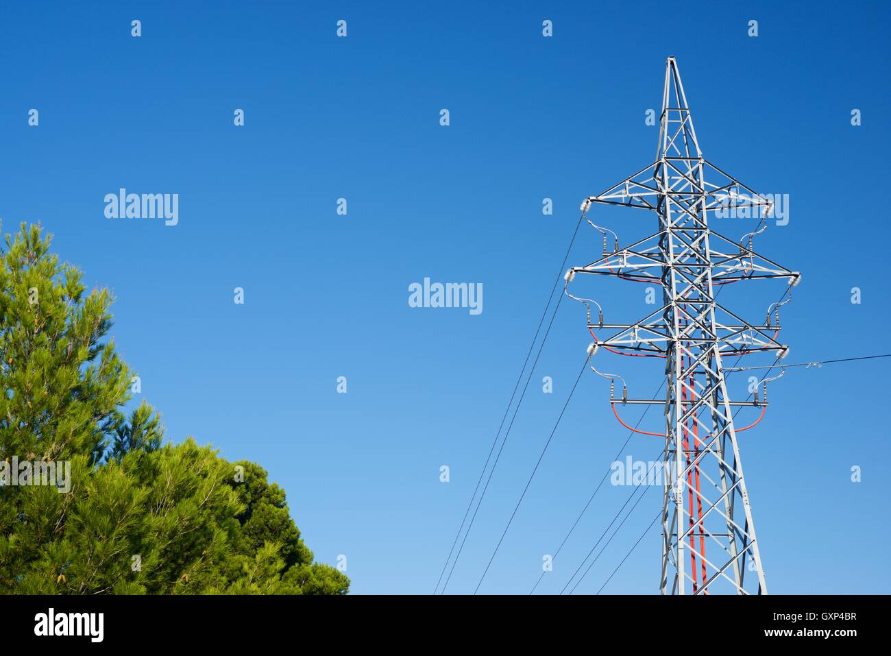 Power line with clear blue sky Stock Photo - Alamy