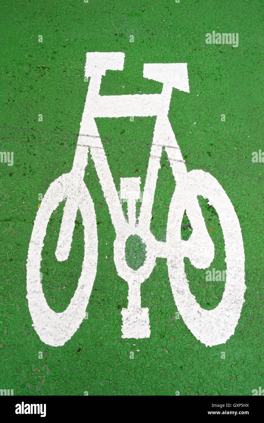 Bike lane sign painted on a street Stock Photo - Alamy