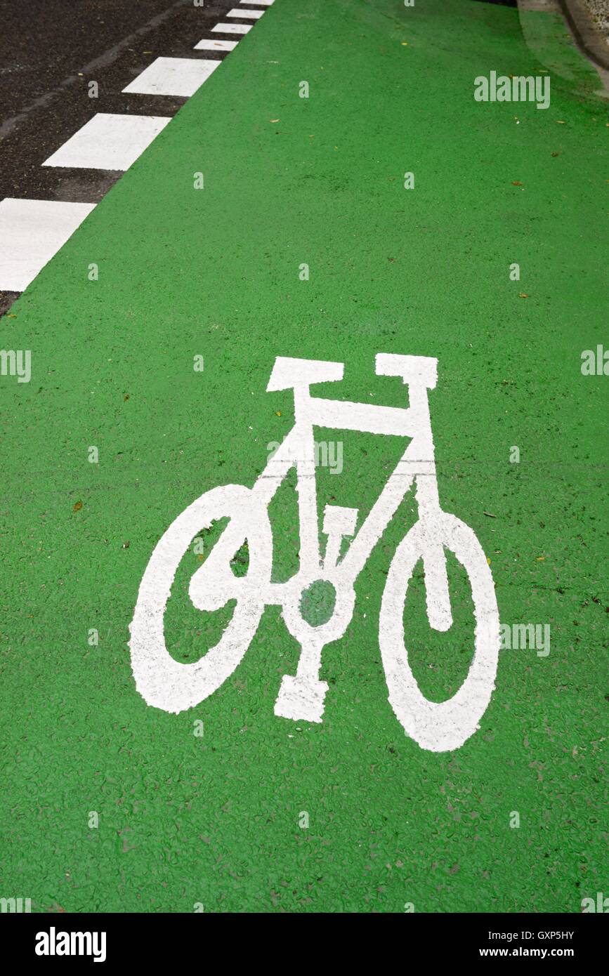 Bike lane sign painted on a street Stock Photo - Alamy