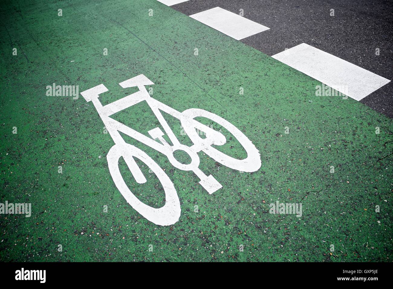Bike lane sign painted on a street Stock Photo - Alamy