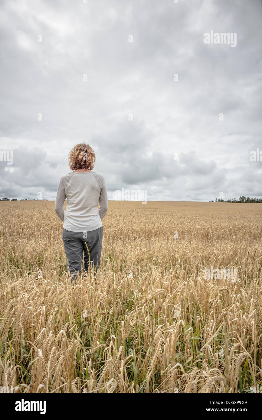 Woman standing field hi-res stock photography and images - Alamy