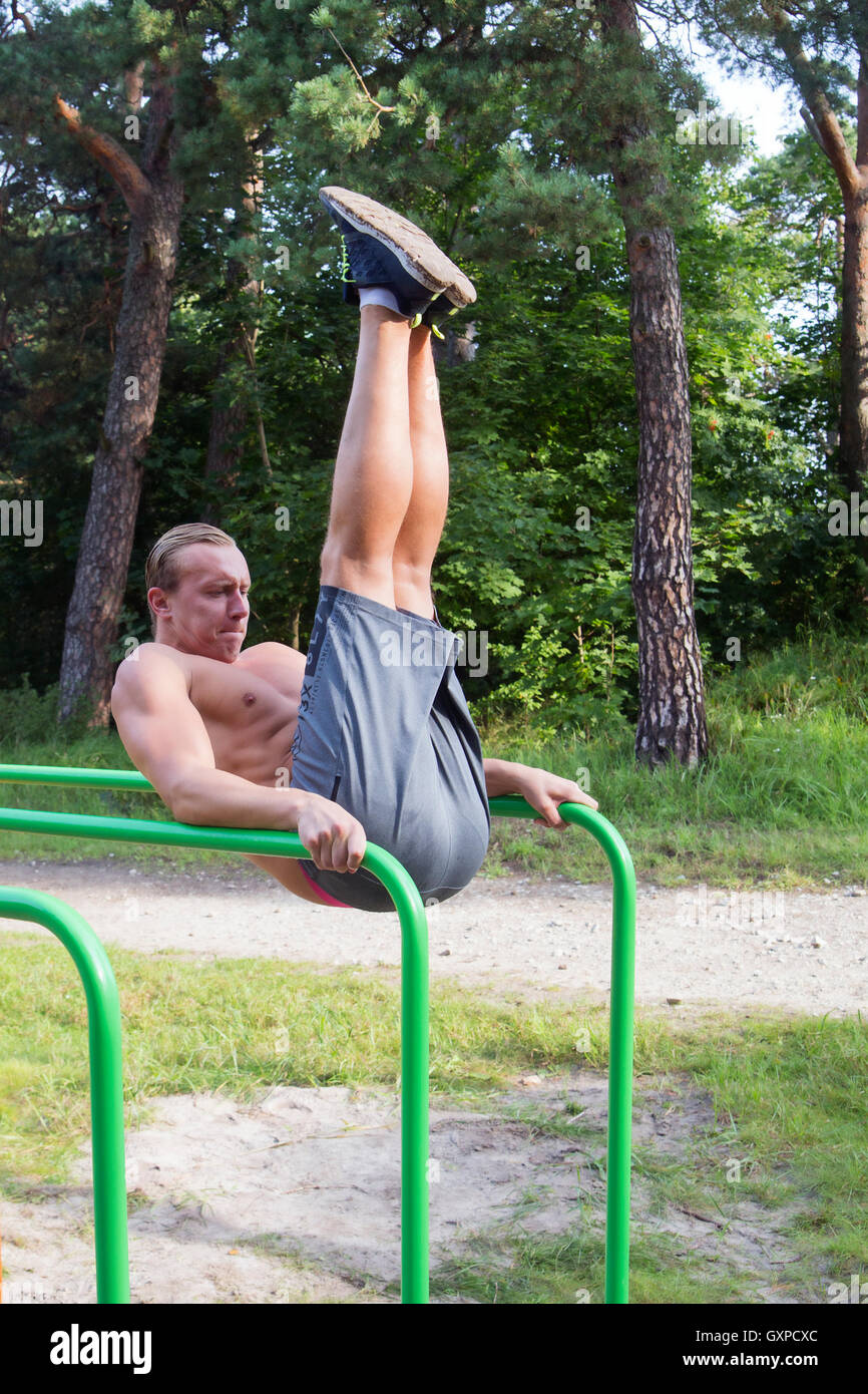 Man feels powerful pressure while train muscles Stock Photo - Alamy