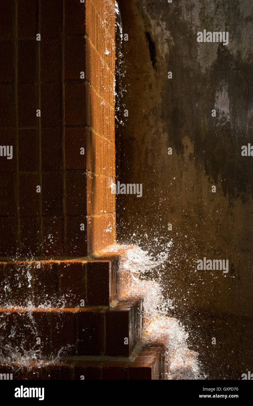 Concrete and brick water fountain in a city Stock Photo - Alamy