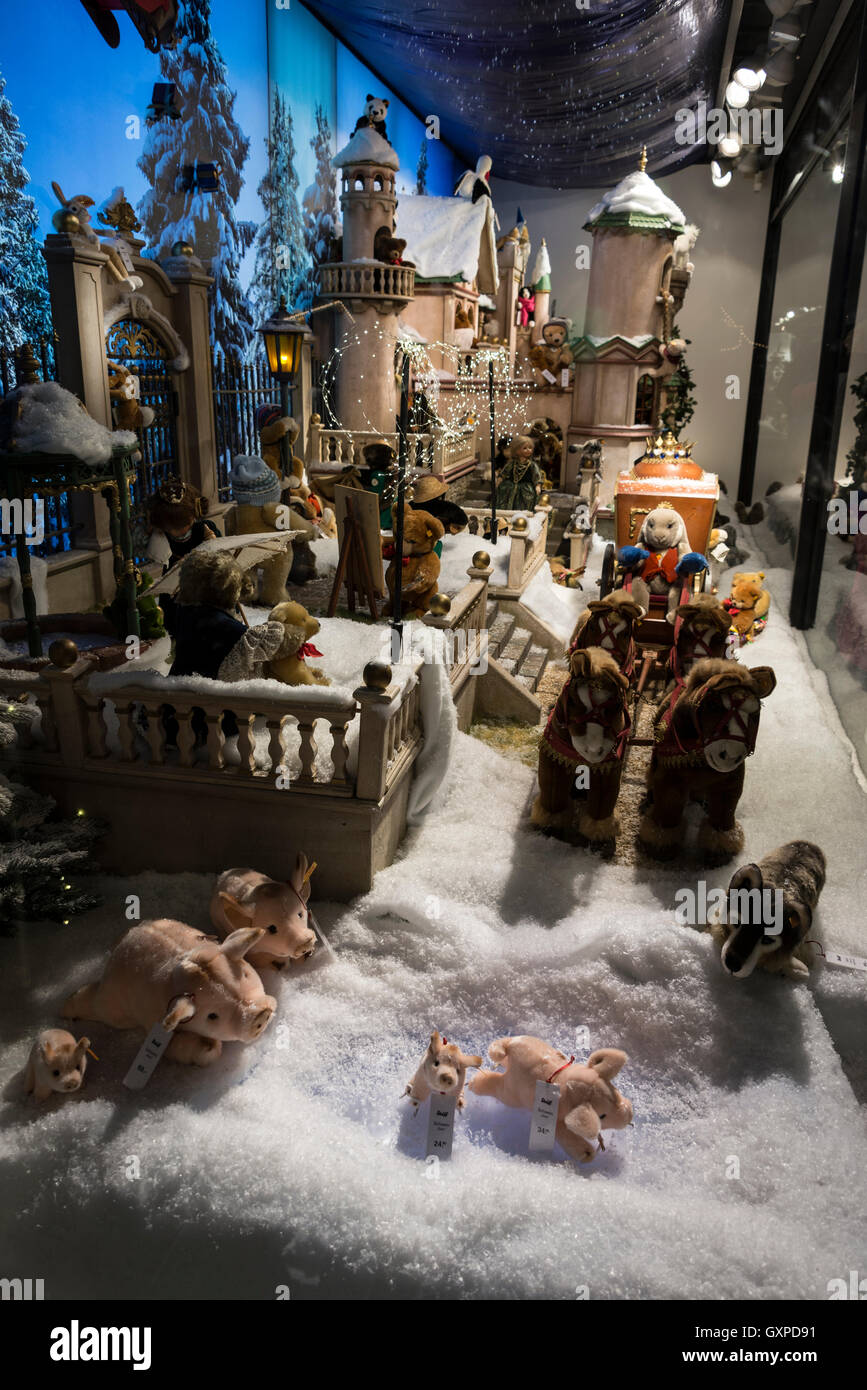 A large store window display attracts passing children to a delightful ...