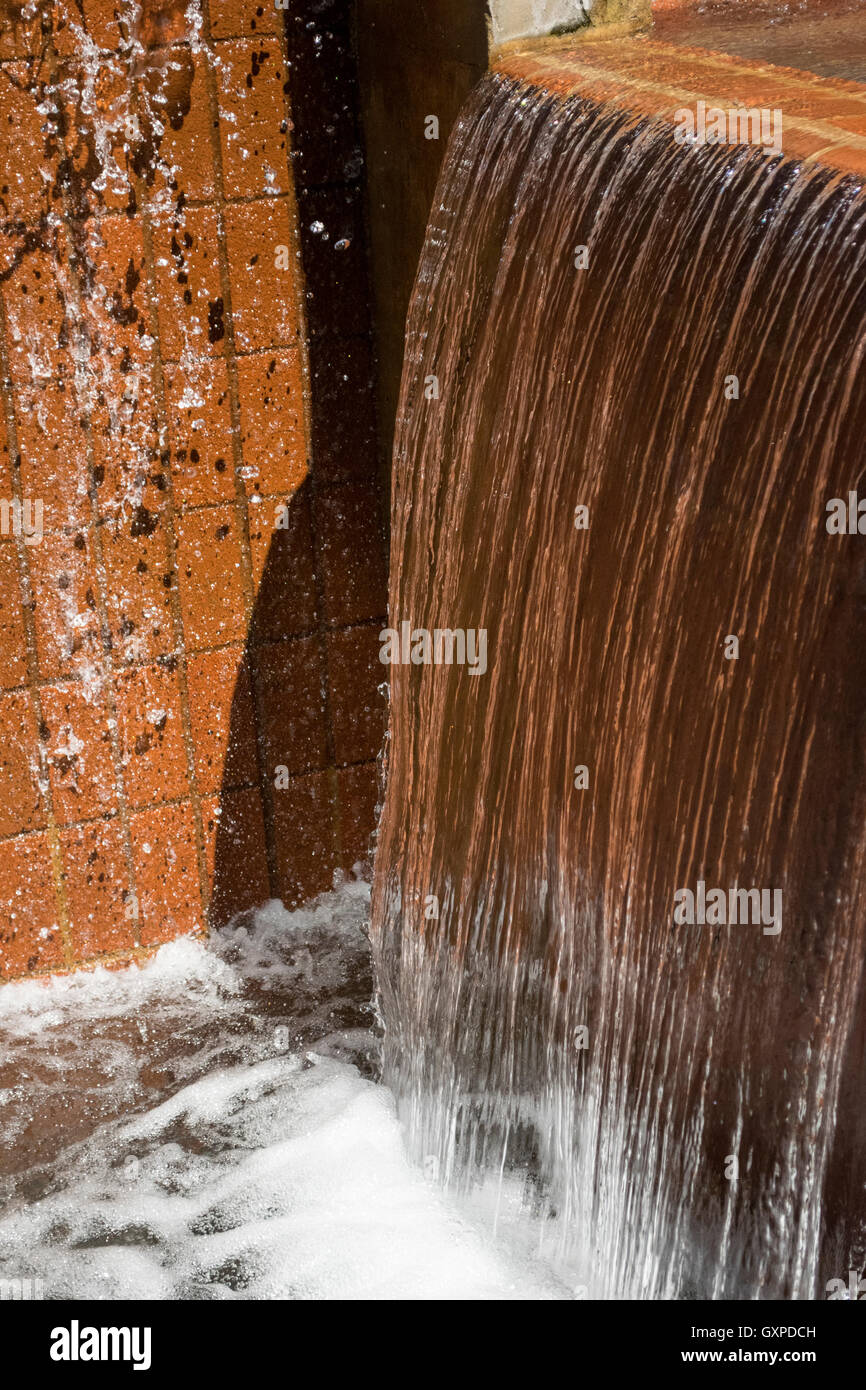 Concrete and brick water fountain in a city Stock Photo - Alamy