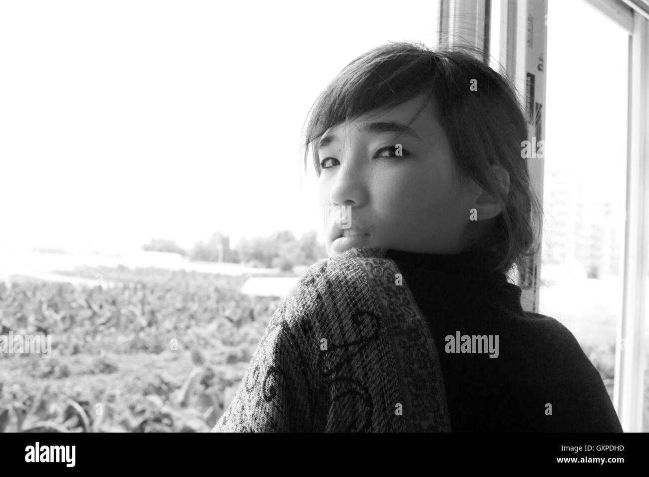 The girl next to the window Stock Photo - Alamy