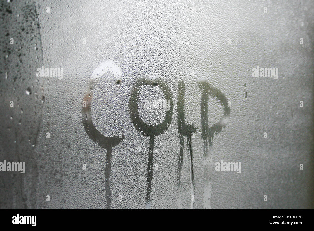 Cold text written in condensation on glass window pane Stock Photo - Alamy
