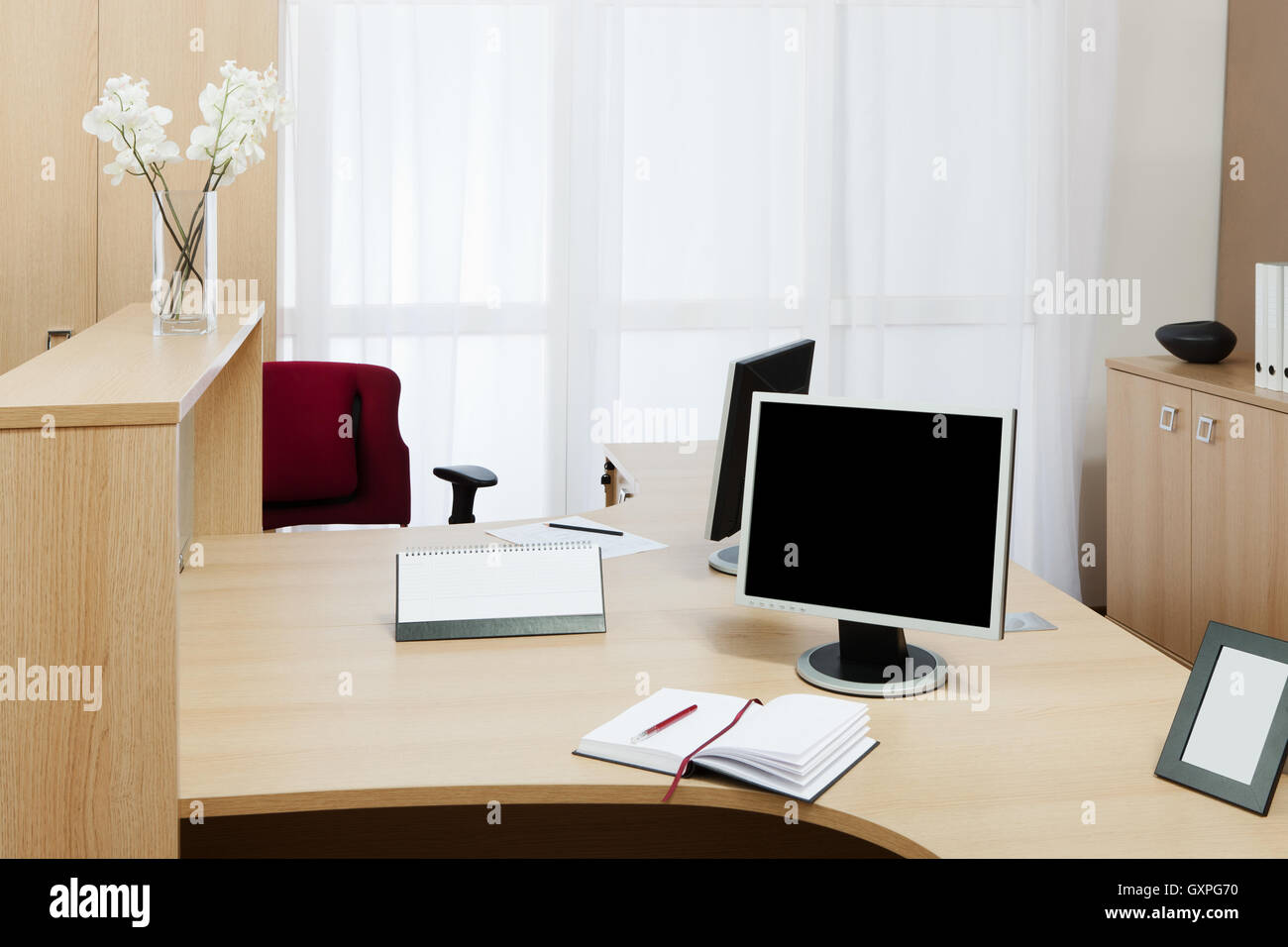 monitor on a desk in a modern office Stock Photo - Alamy