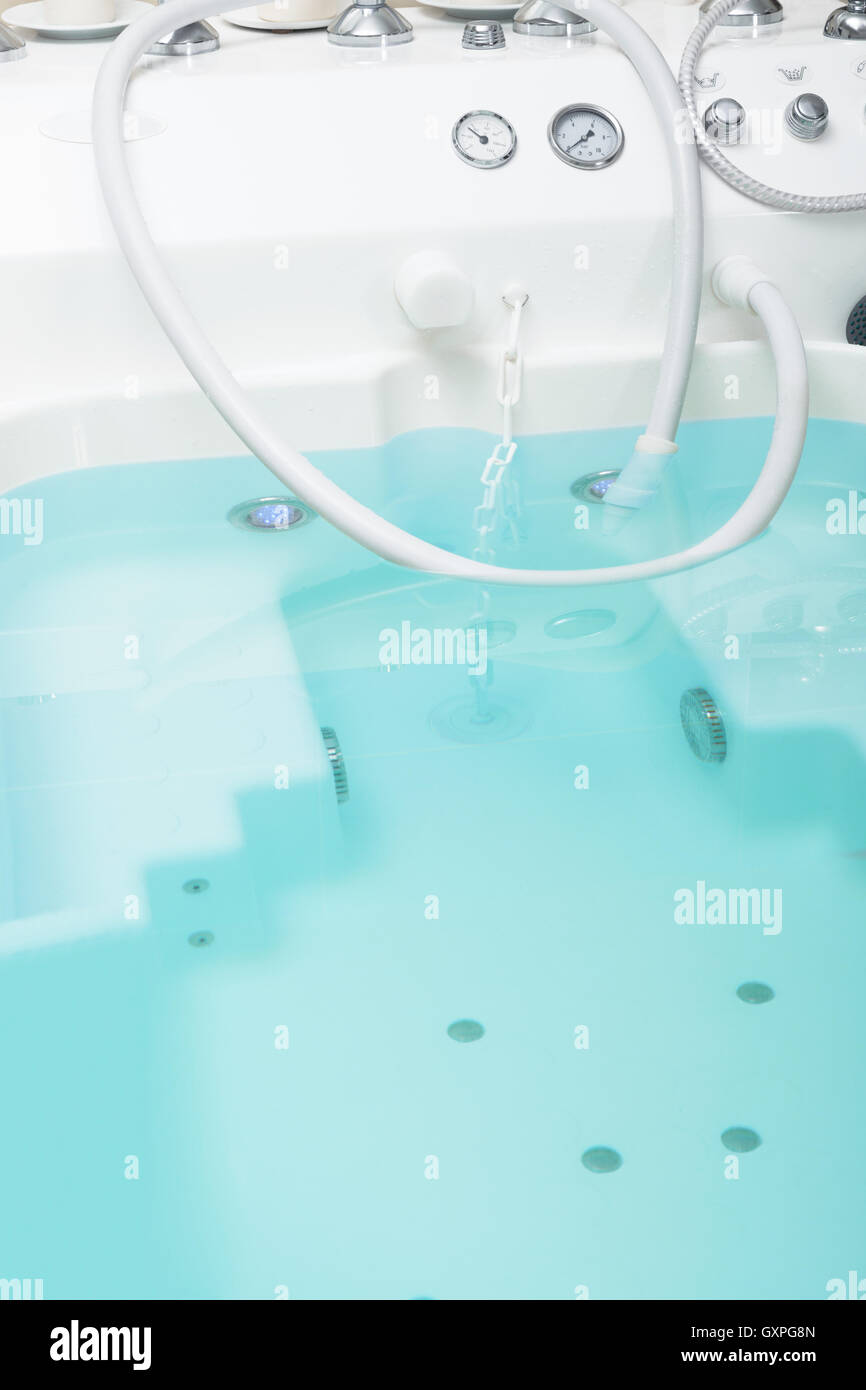 beautiful and white jacuzzi filled with water Stock Photo - Alamy