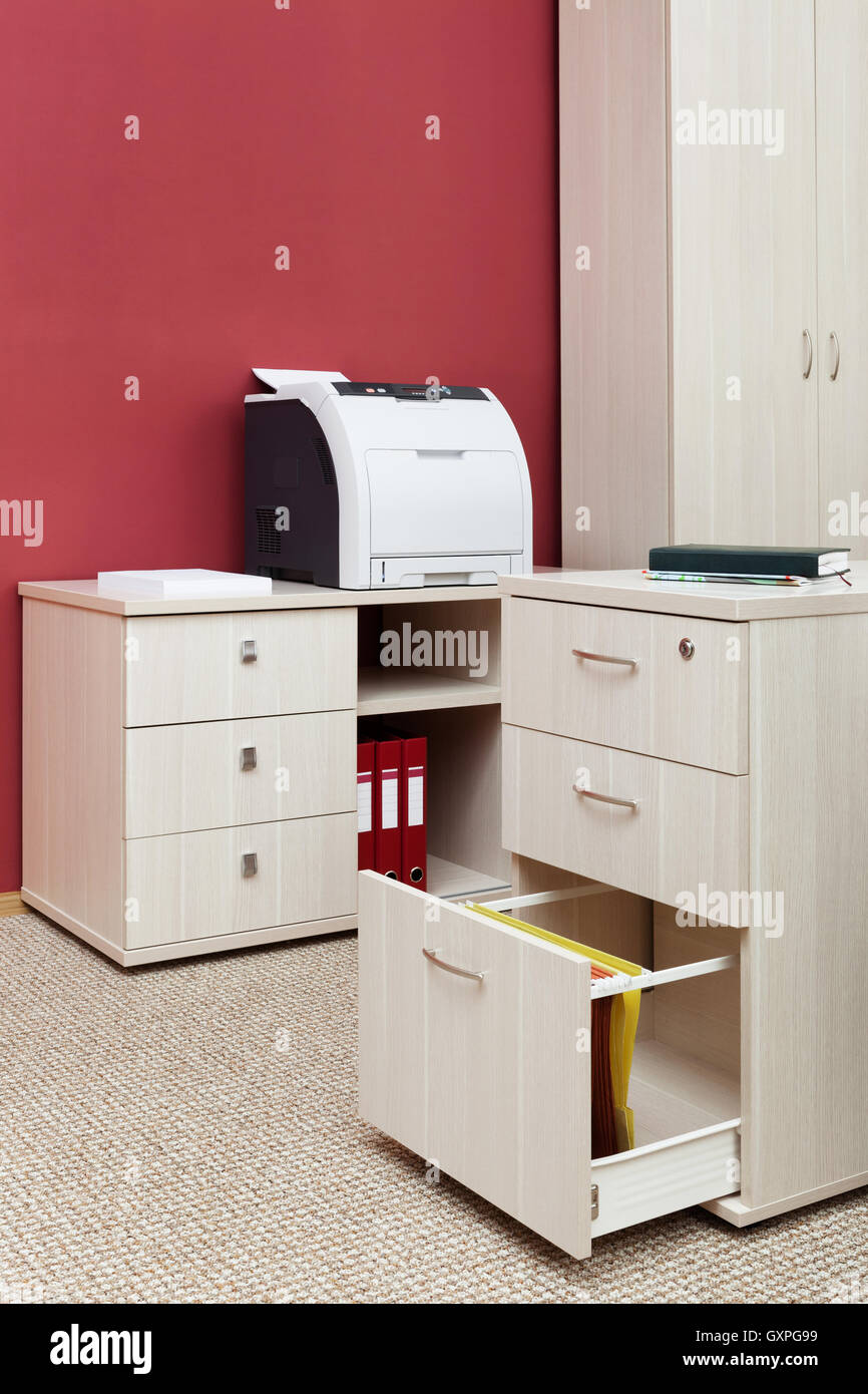 printer from the cabinet in a modern office Stock Photo - Alamy