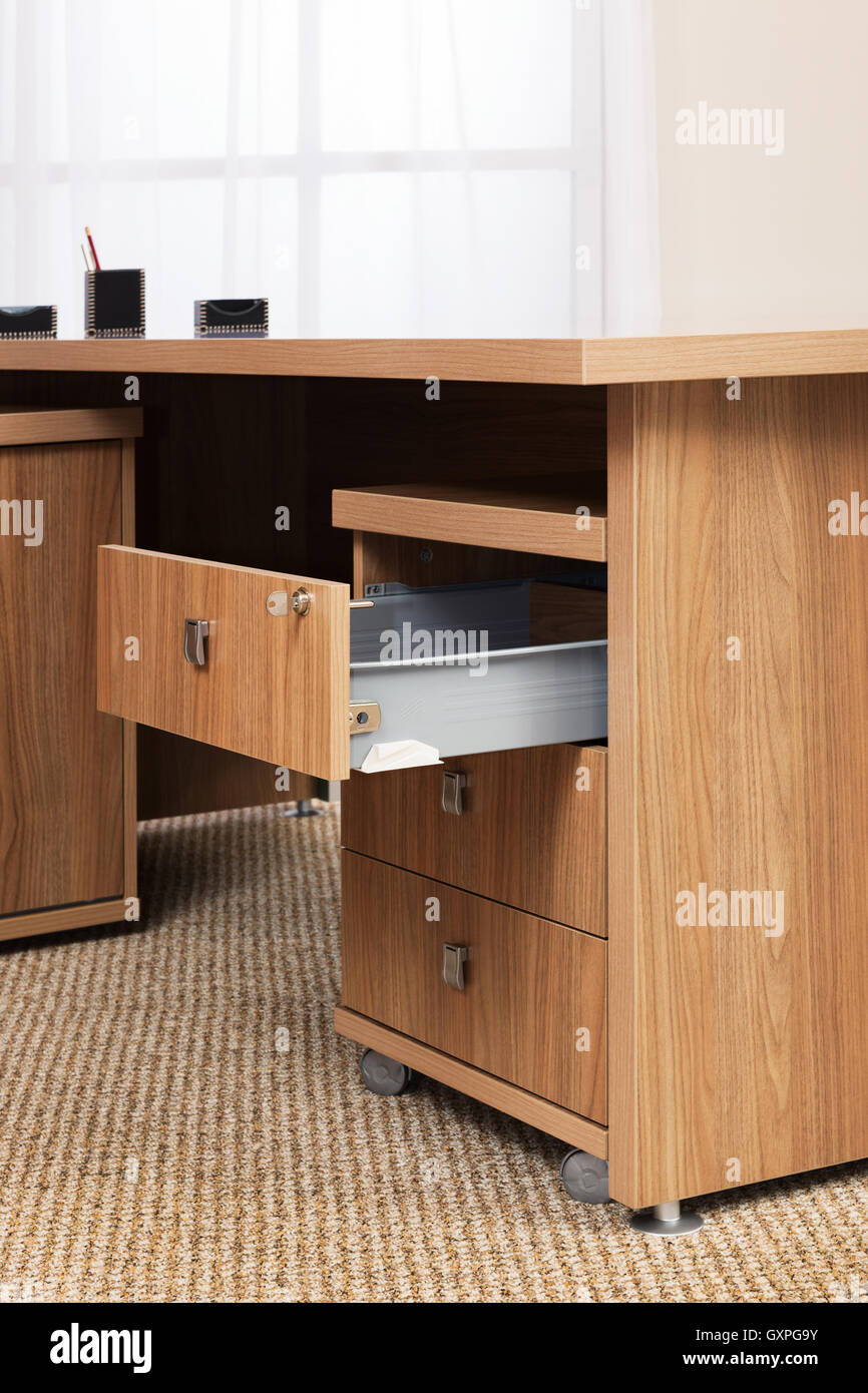 wooden desk with an open box in the office Stock Photo - Alamy