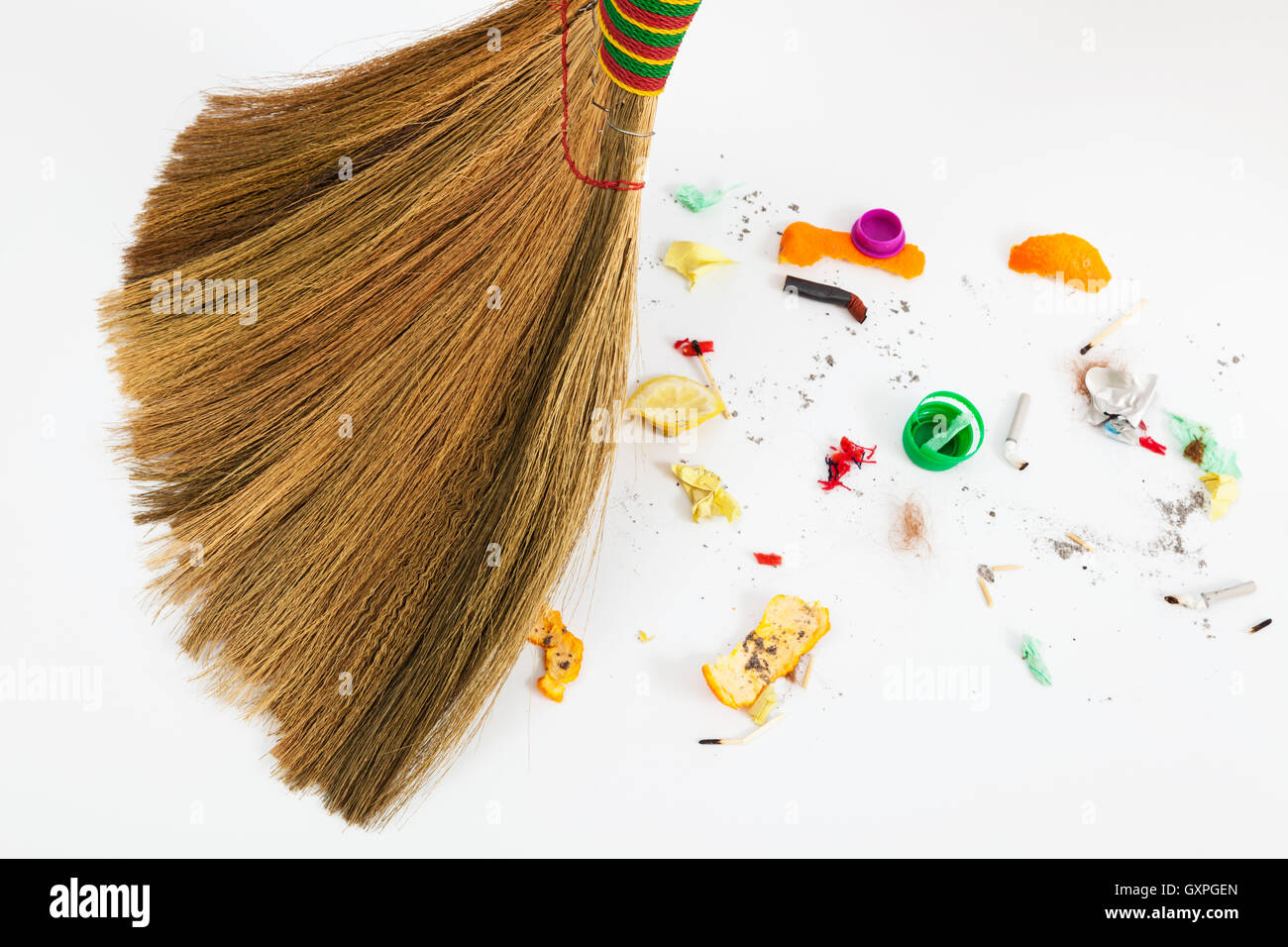a new broom sweeping various debris and mud Stock Photo - Alamy