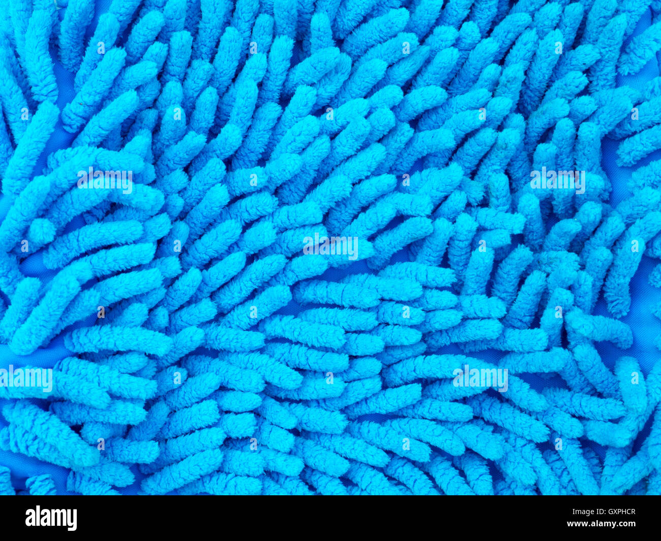Bright blue fluffy microfiber mop texture Stock Photo - Alamy