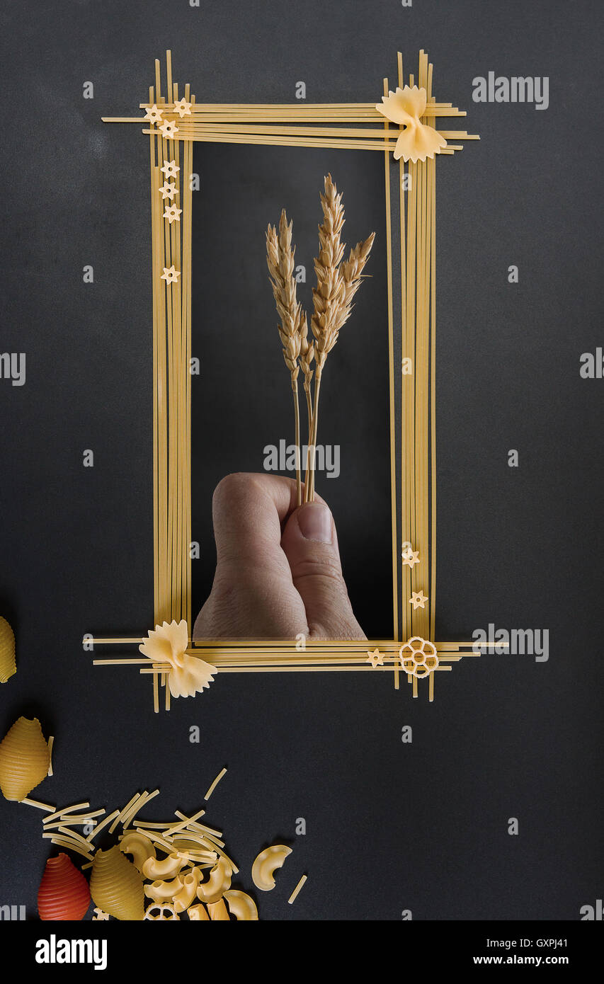 spaghetti and other pasta as a frame on a dark background Stock Photo ...