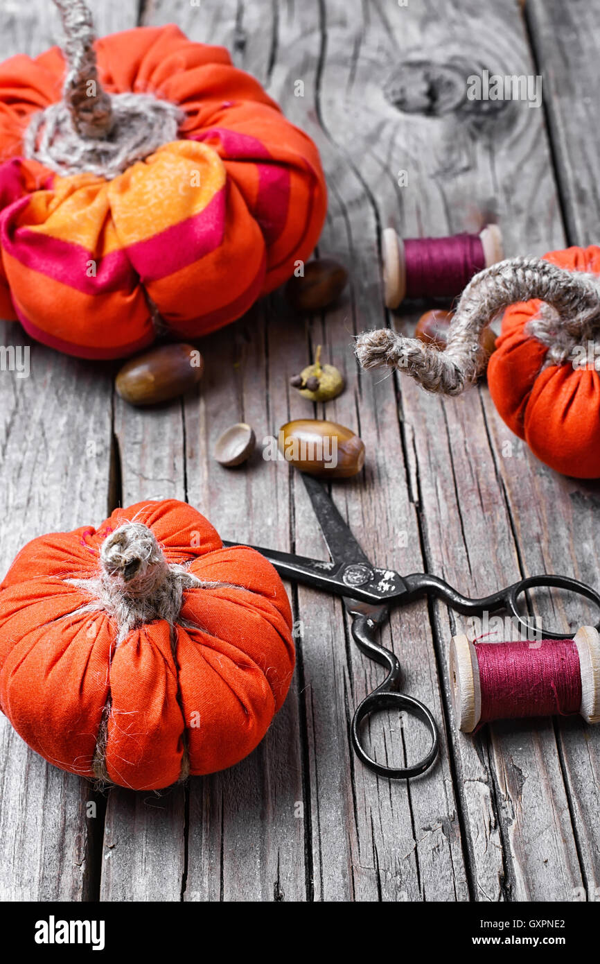 Sewing decorative pumpkins from fabric for autumn decorations Stock ...