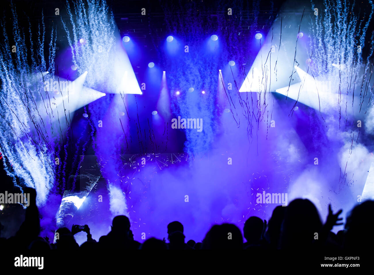 Cheering crowd in front of bright colorful stage lights - retro styled ...