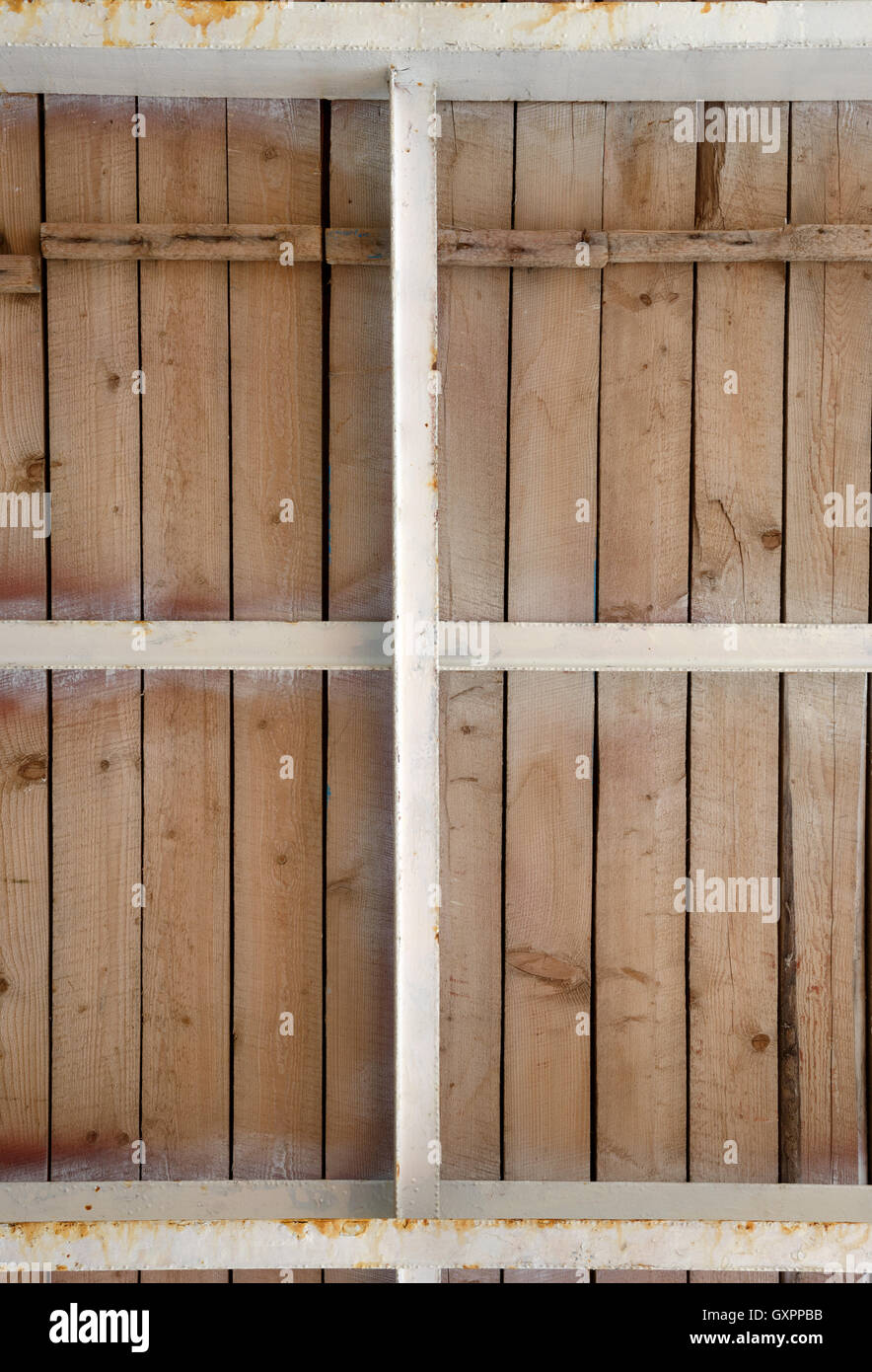 Bottom view of wooden board-walk on metal bearers and joists painted ...