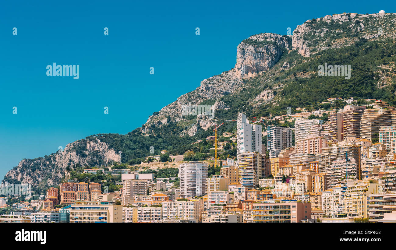 Monaco, Monte Carlo Architecture On Mountain Hill Background. Many ...