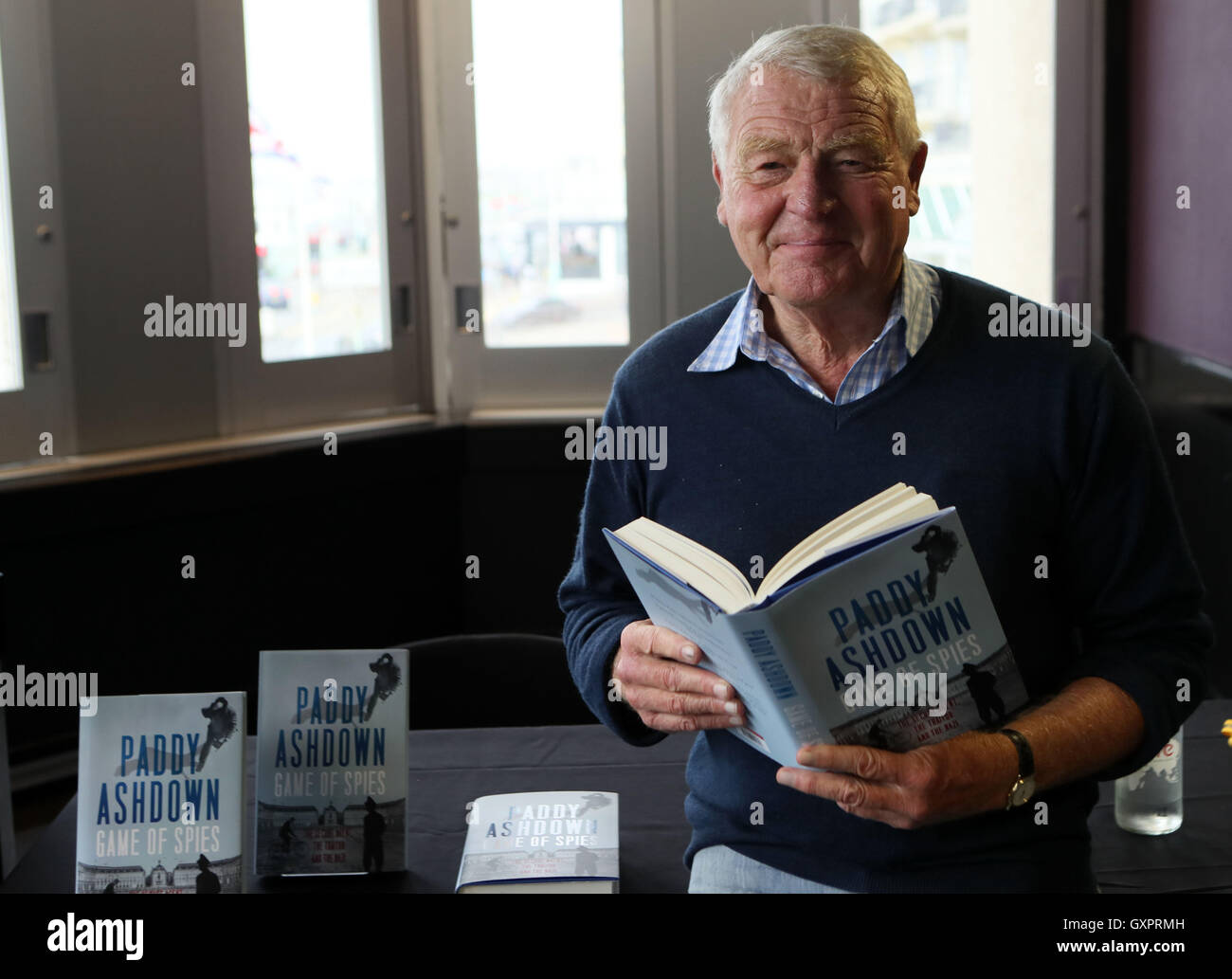 Former Liberal Democrat leader Paddy Ashdown signs copies of his book ...