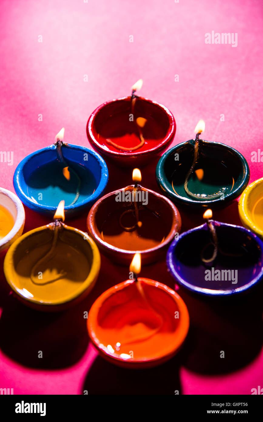 colourful diwali diya on colourful background, suitable for diwali ...