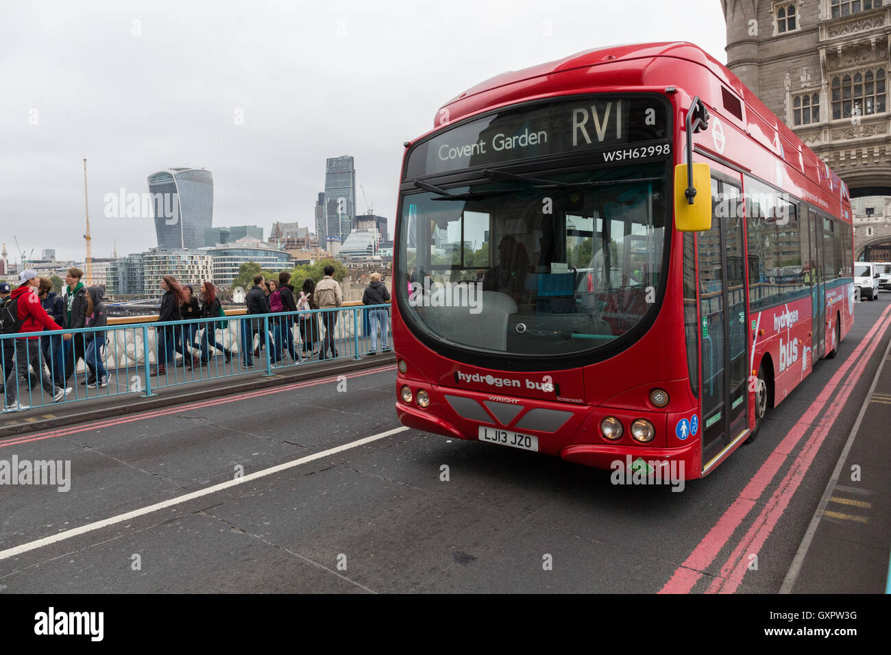 The TFL RV1 London red bus on Tower Bridge London Stock Photo - Alamy