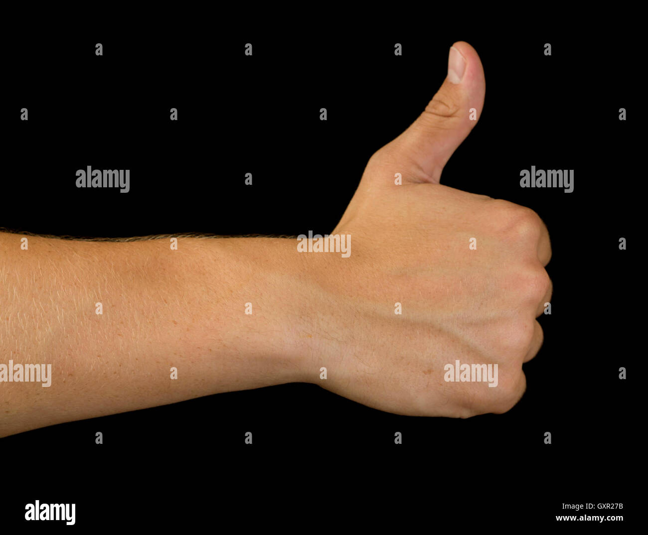 Closeup of hand showing thumbs up sign against black background Stock ...