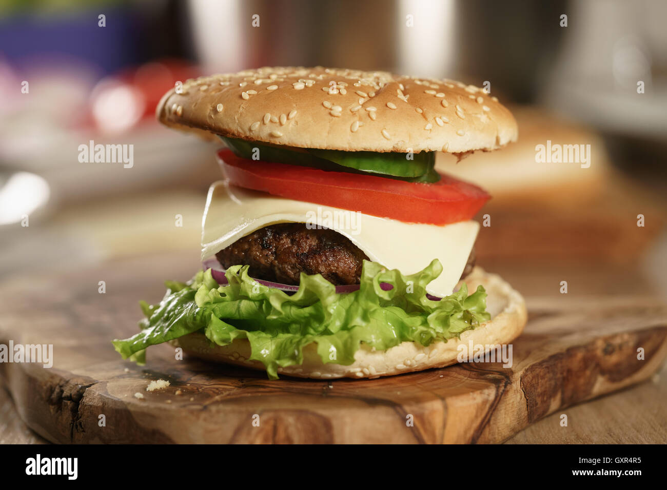 fun made fresh burger with marble beef, cheese and vegetables on olive ...