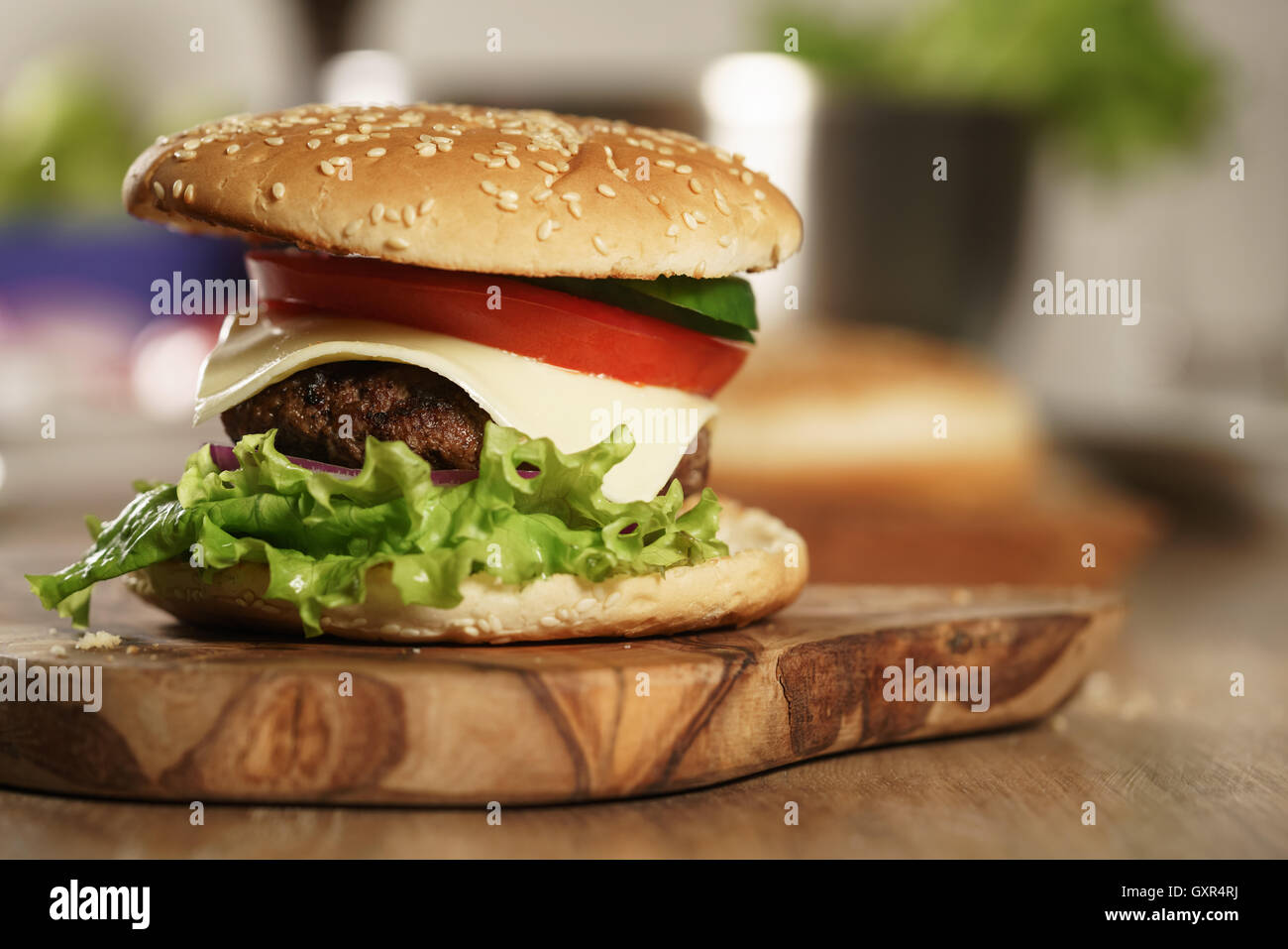 fun made fresh burger with marble beef, cheese and vegetables on olive ...