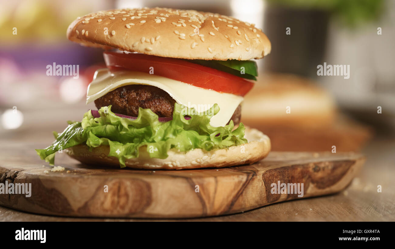 fun made fresh burger with marble beef, cheese and vegetables on olive ...
