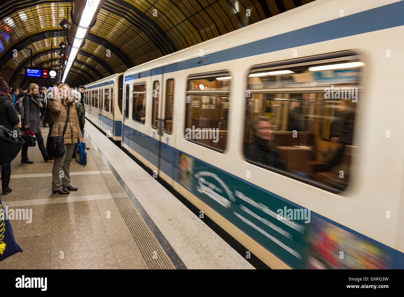 A U-bahn train arrives at one of the metro stations in Munich, Germany ...