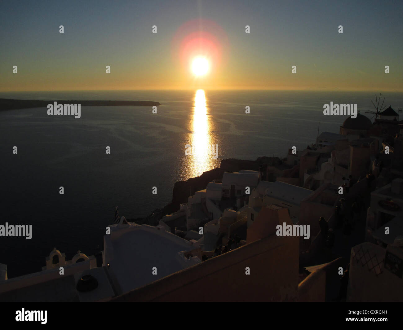The Famous Oia Sunset at Oia Village, Santorini Island of Greece Stock ...
