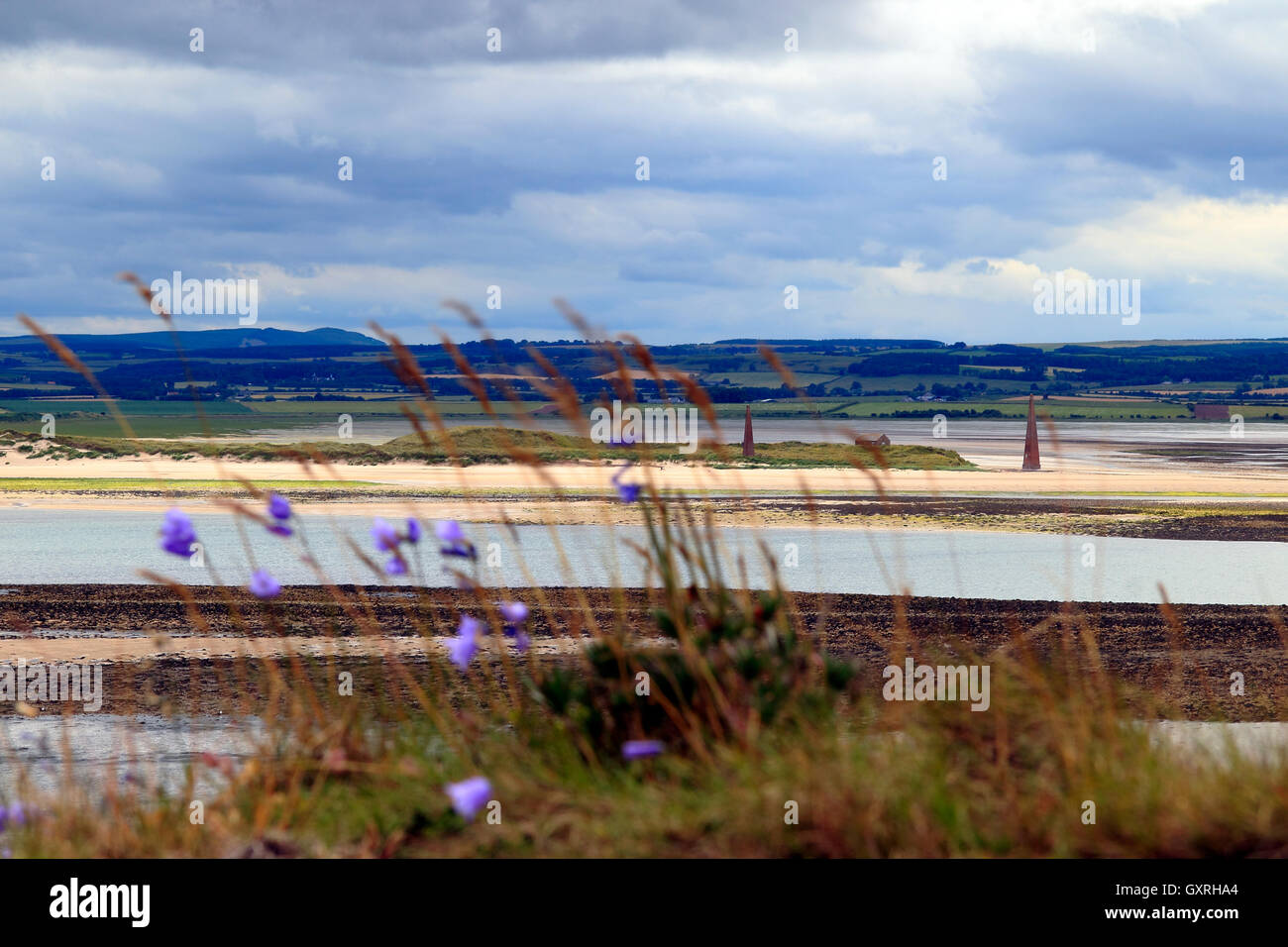 Lindisfarne lighthouses, Guile Point, stone obelisks in the distance ...