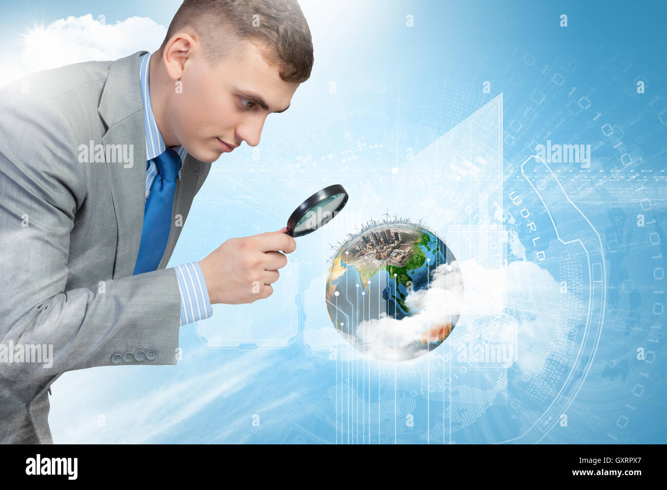 Man looking in magnifier Stock Photo - Alamy