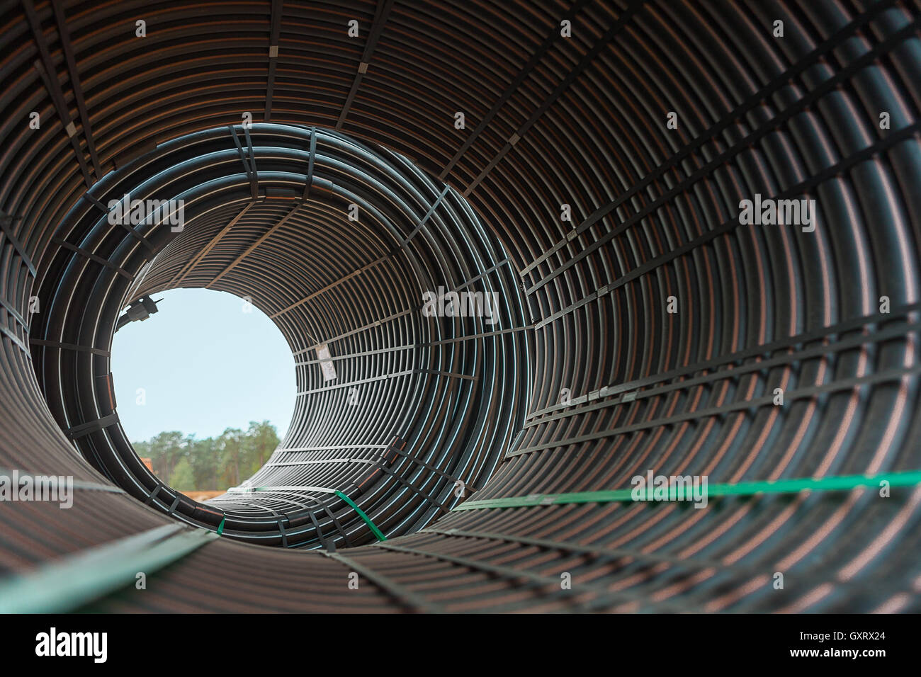 in roll of pipe Stock Photo - Alamy