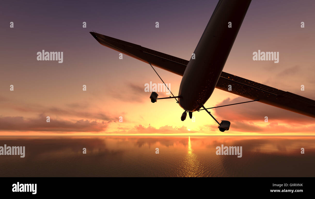 Plane over the ocean Stock Photo - Alamy