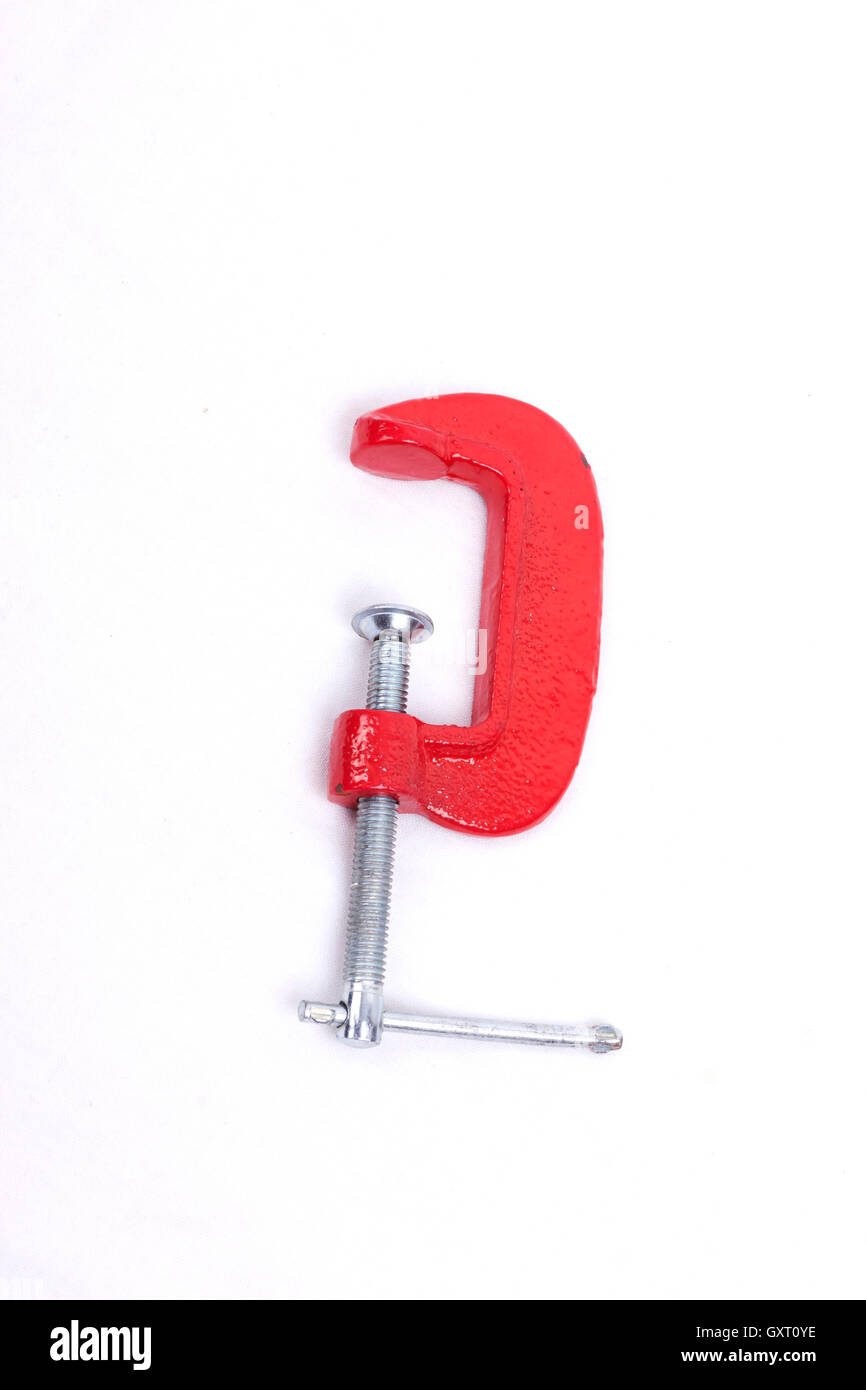 Red clamp on a white background Stock Photo - Alamy