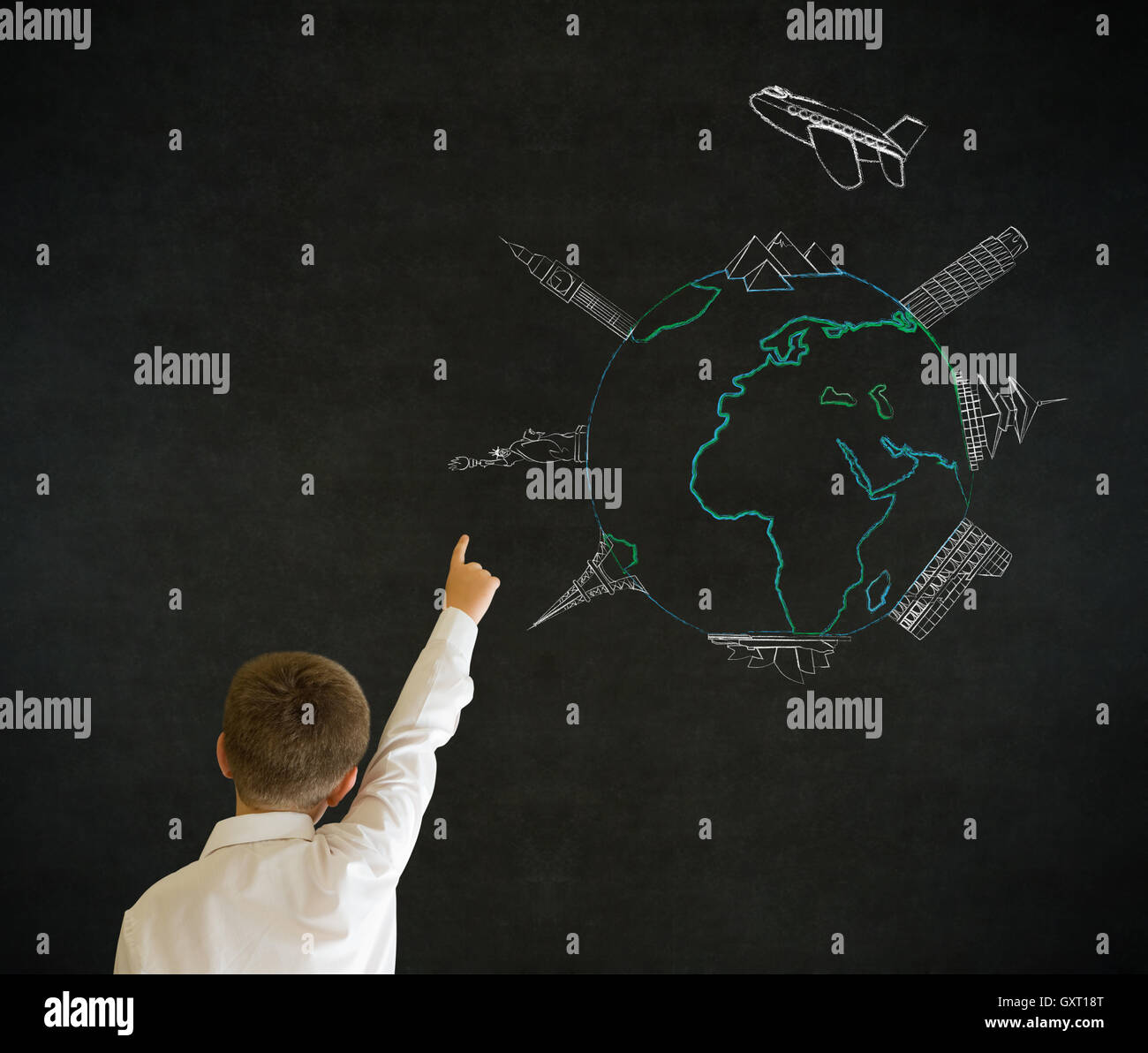 Boy dressed as business man with chalk world wonders on background ...