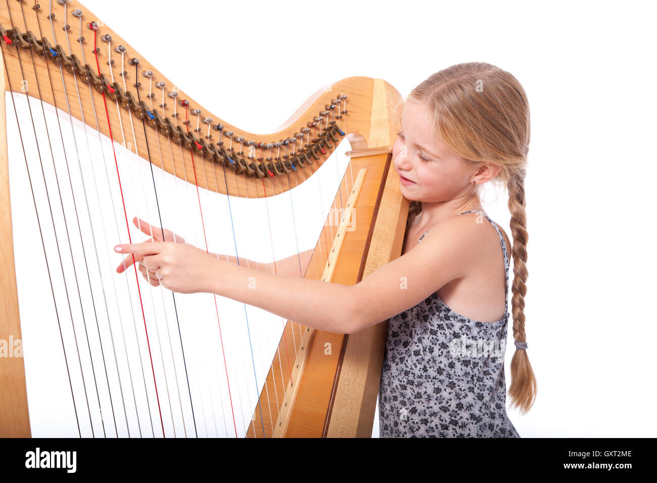 young girl in blue playing harp Stock Photo - Alamy