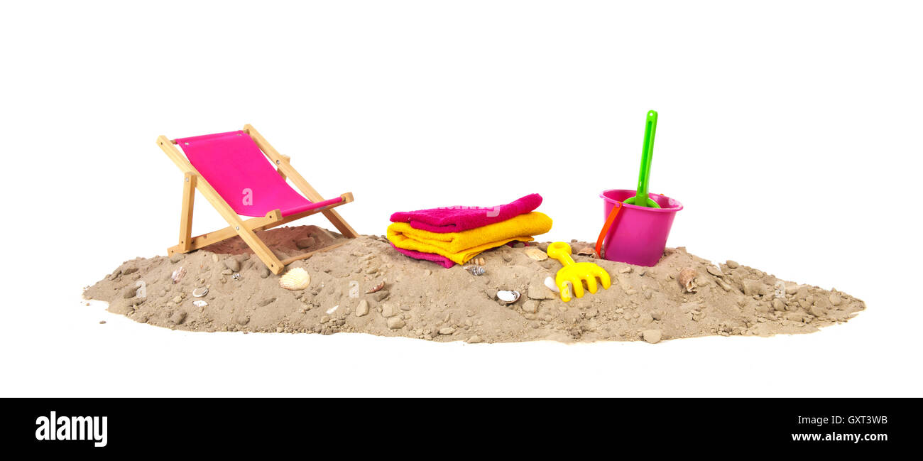 Beach sand with chair and toys Stock Photo - Alamy