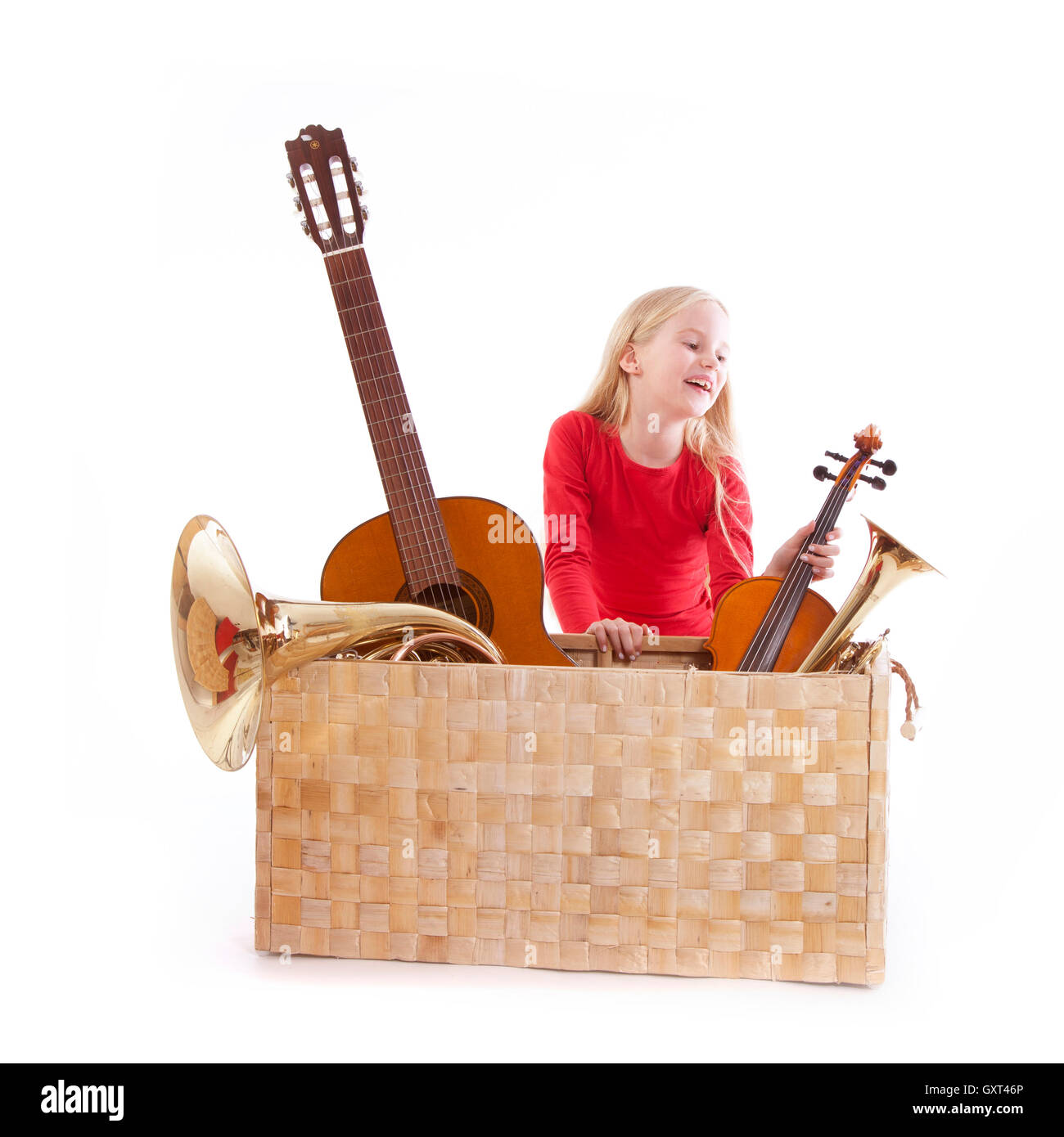 young girl with musical instruments in box Stock Photo - Alamy