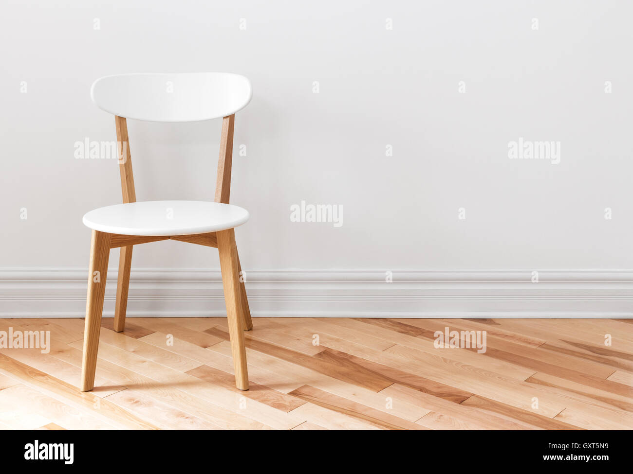 White chair in an empty room Stock Photo - Alamy