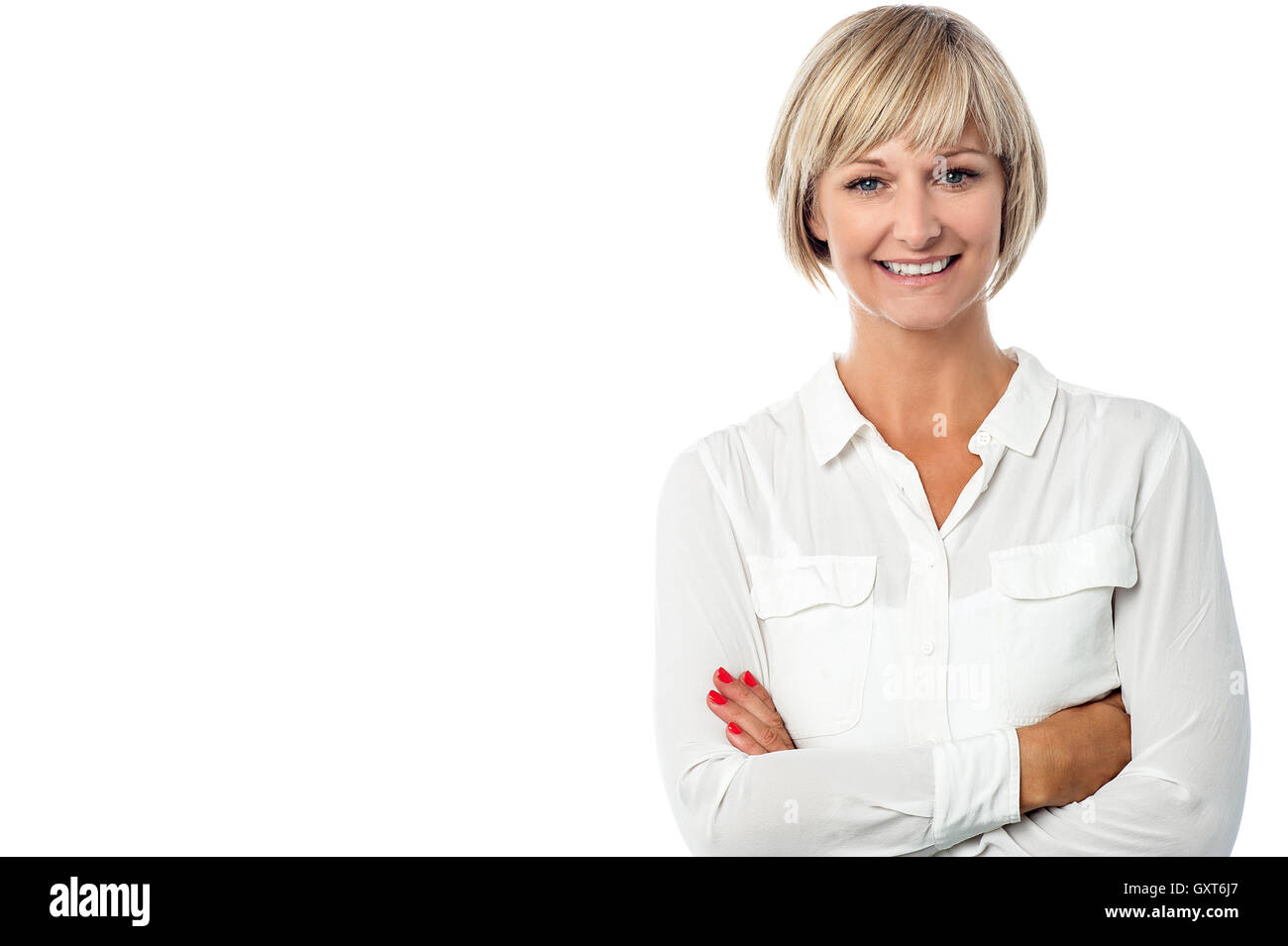 Smiling middle aged lady, arms crossed Stock Photo - Alamy