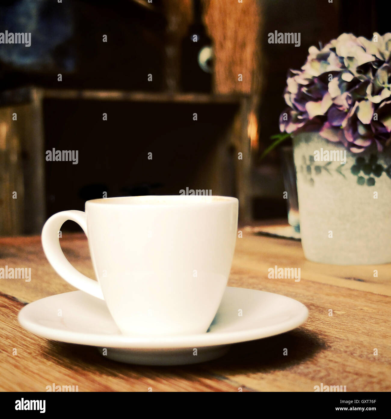 Cup of coffee with flower at coffee shop, retro filter effect Stock ...