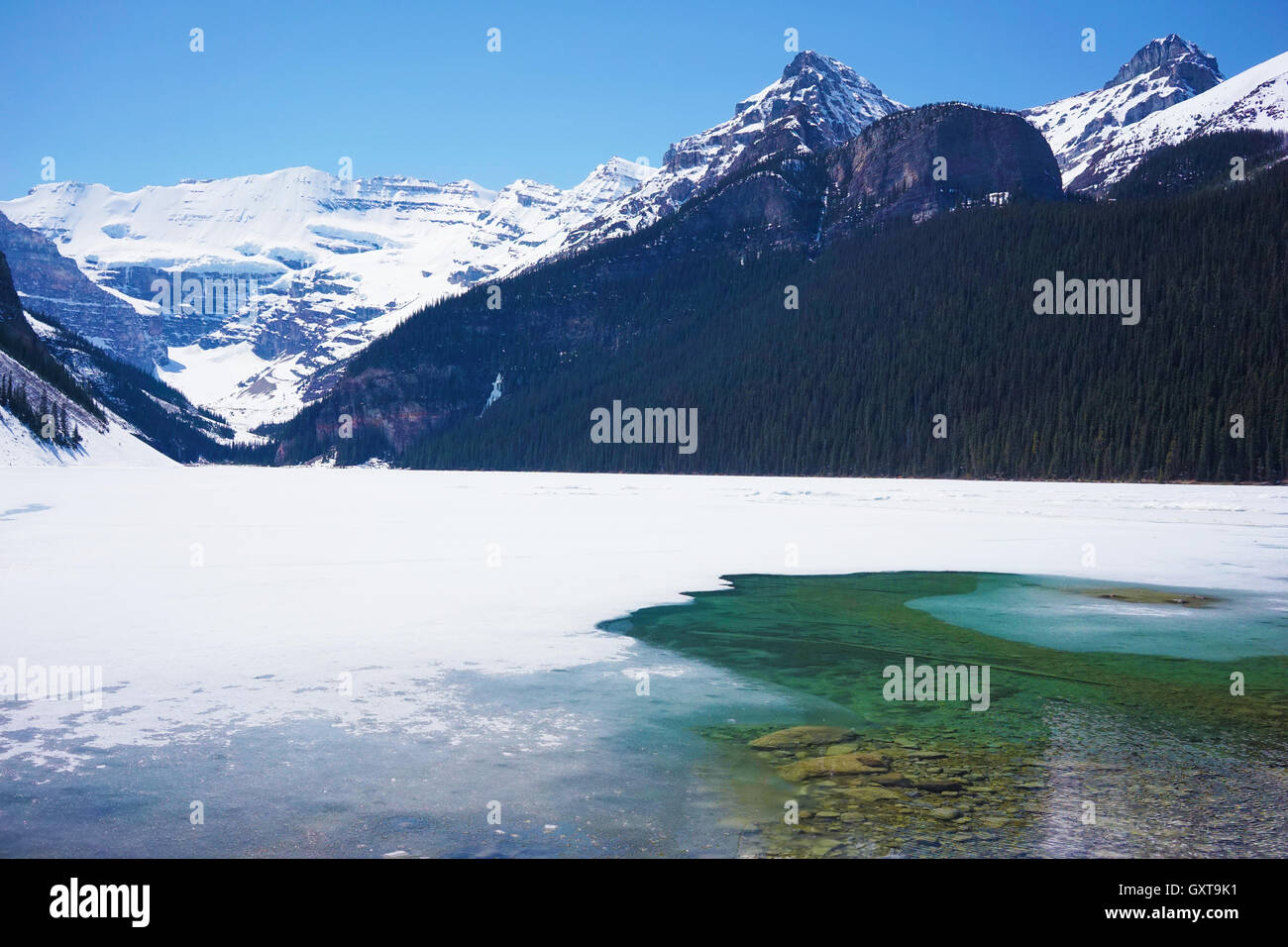 Frozen Lake Louise in snowy Rocky Mountains Stock Photo - Alamy