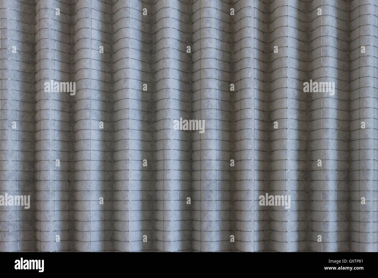 Pleated wadding and wire mesh design background Stock Photo - Alamy
