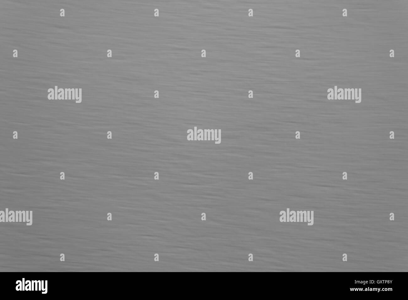 Textured medium grey background with a horizontal blur Stock Photo - Alamy