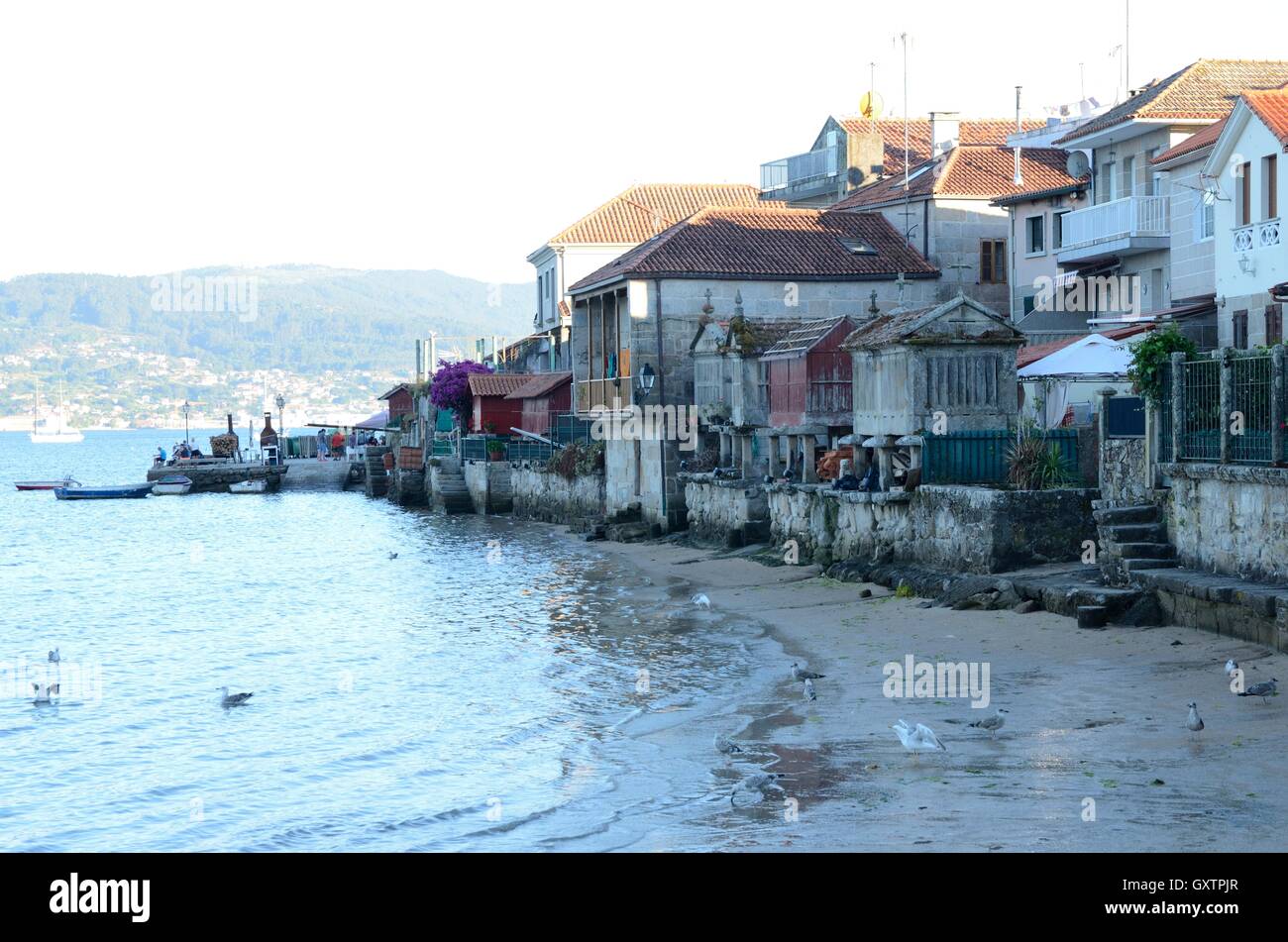 Typical houses at the coastal edge of the seaside village of Combarro ...