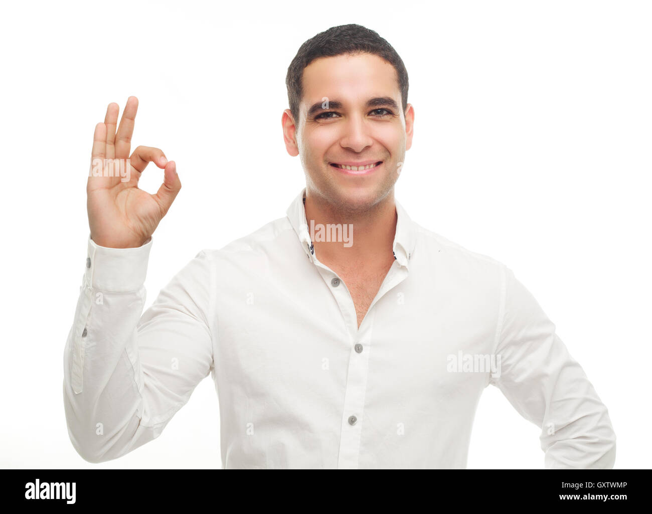 happy smiling young man with his an OK sign isolated against white ...