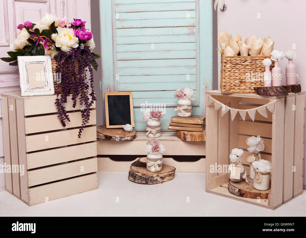 Interior decoration setup with flowers and picture frame.Pink doors ...